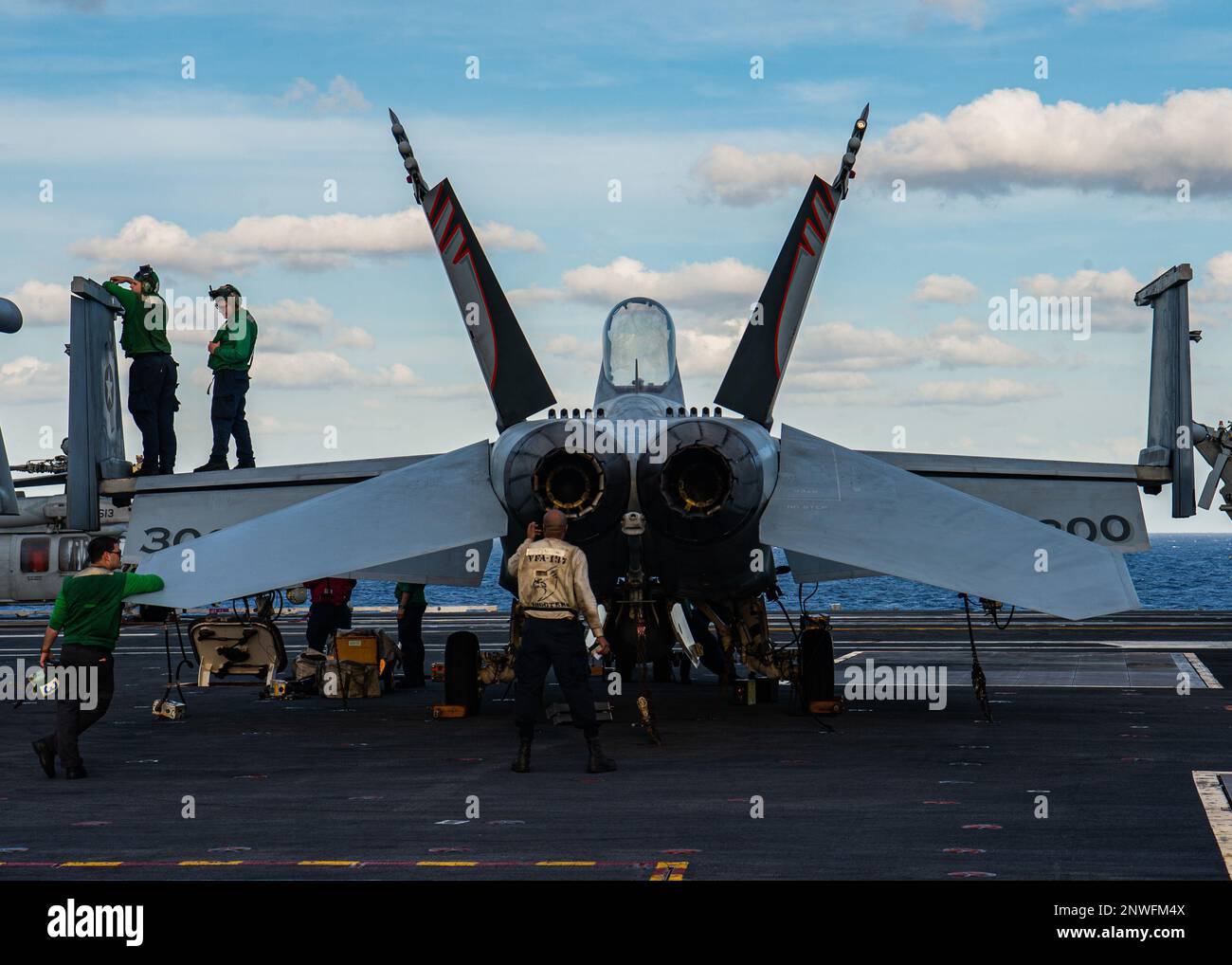230107-N-MH015-1005 PHILIPPINE SEA (Jan. 7, 2023) U.S. Navy Sailors perform maintenance on an F ...