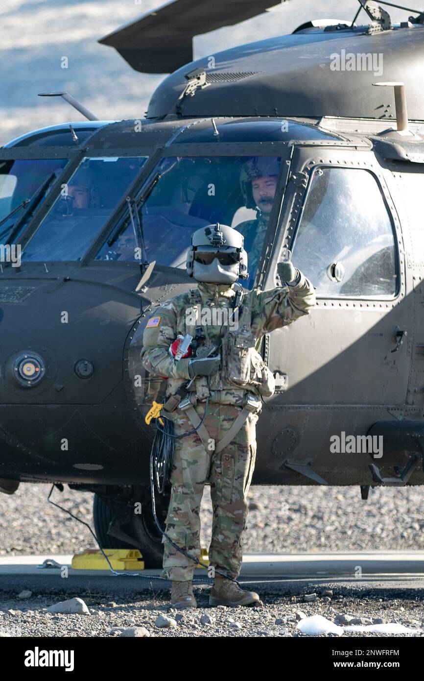 A UH-60M Black Hawk helicopter crew chief assigned to Bravo Company, 2 ...