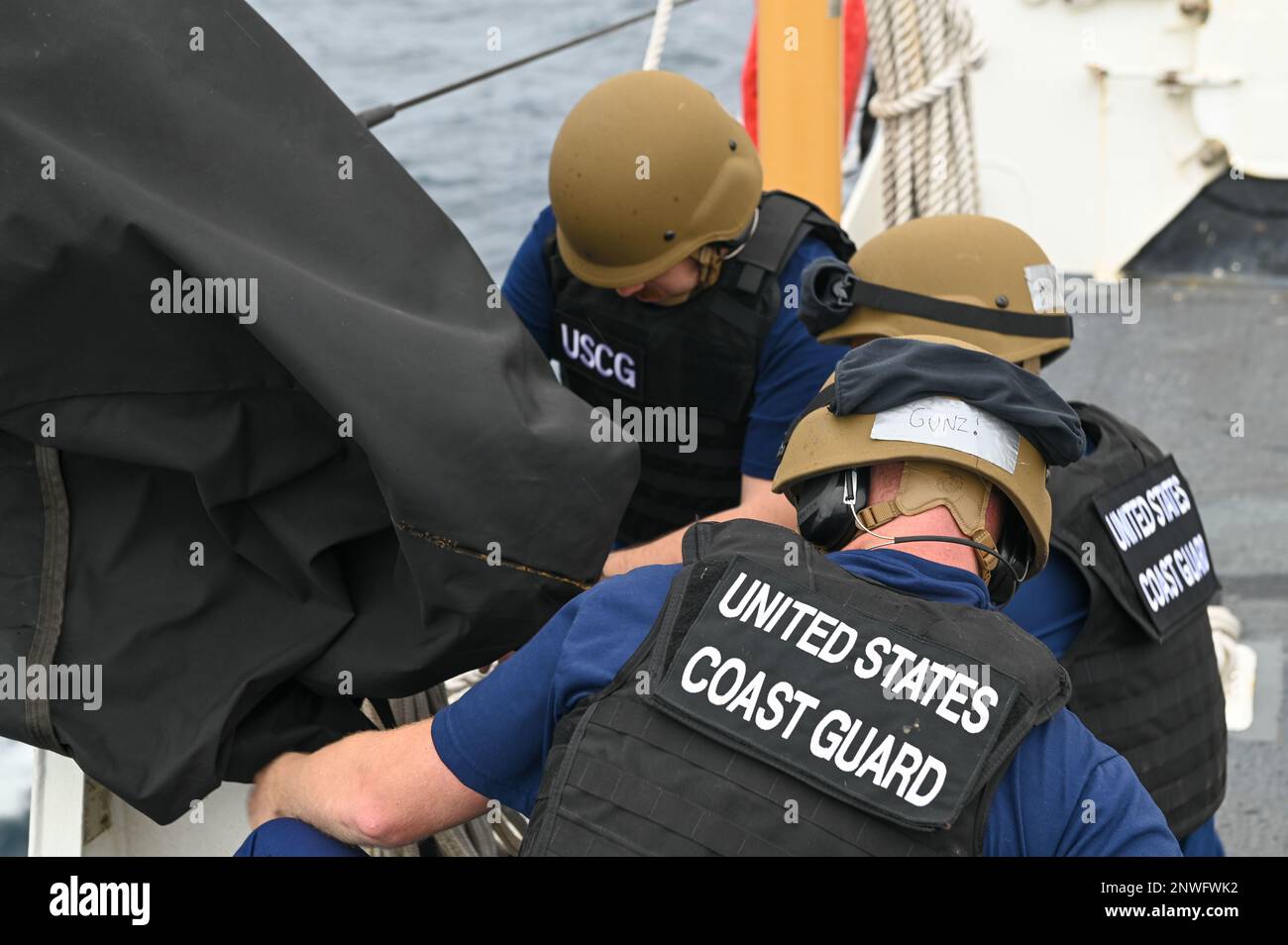 A USCGC Stone (WMSL 758) starboard gun crew inspects a .50-caliber ...