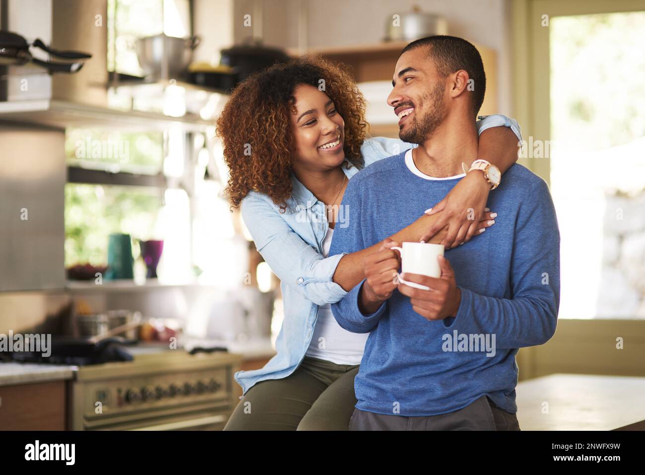 Honey, youre the best. Shot of a happy young couple feeling relaxed in ...