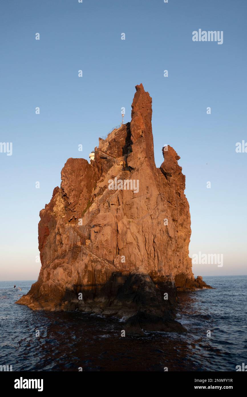 small island of strombolicchio, a tiny volcanic island next to the ...