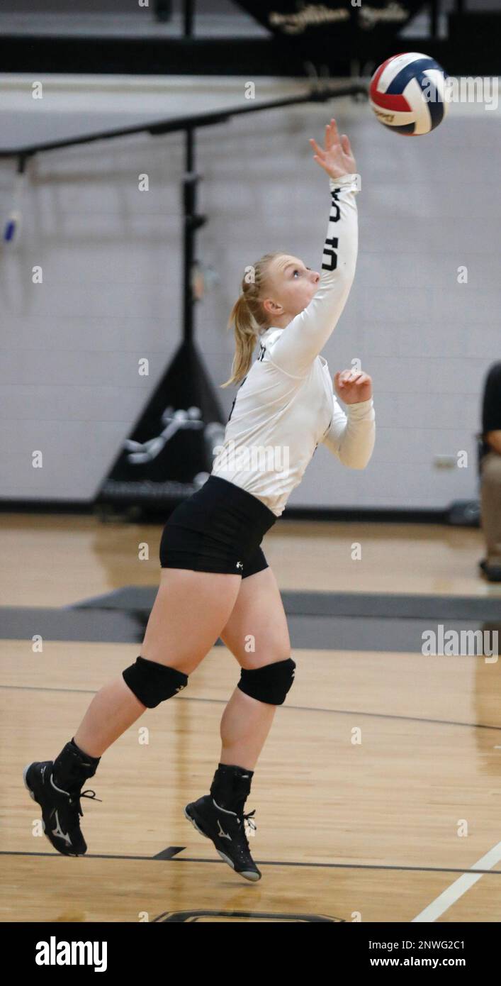 Permian High's Rylee Day (5) serves in the first set. Permian High ...