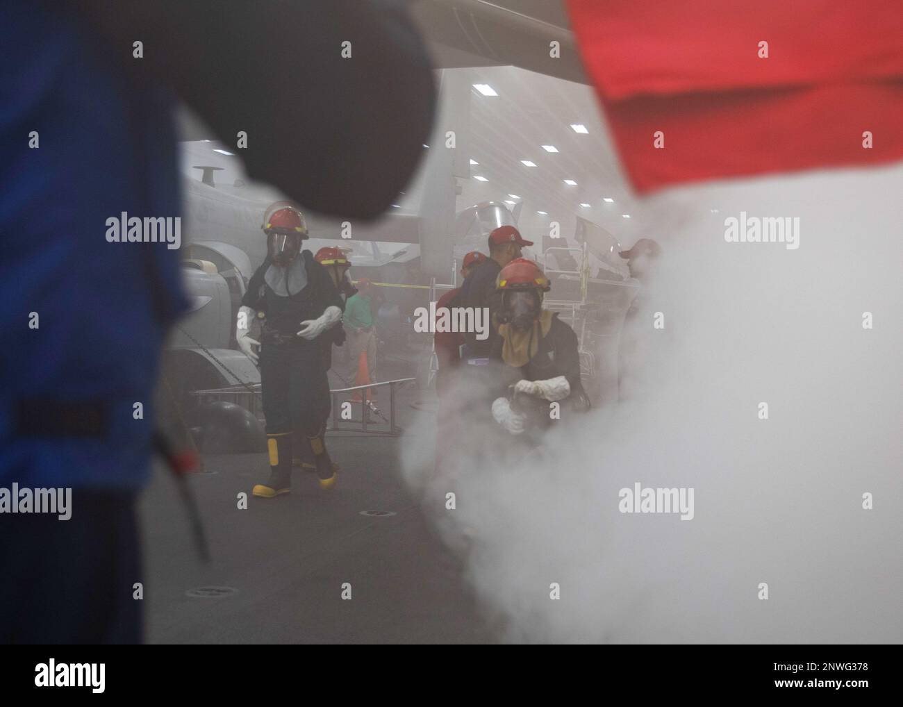 230106-N-IV962-1174 Fireman Logan Conrad combats a simulated fire ...