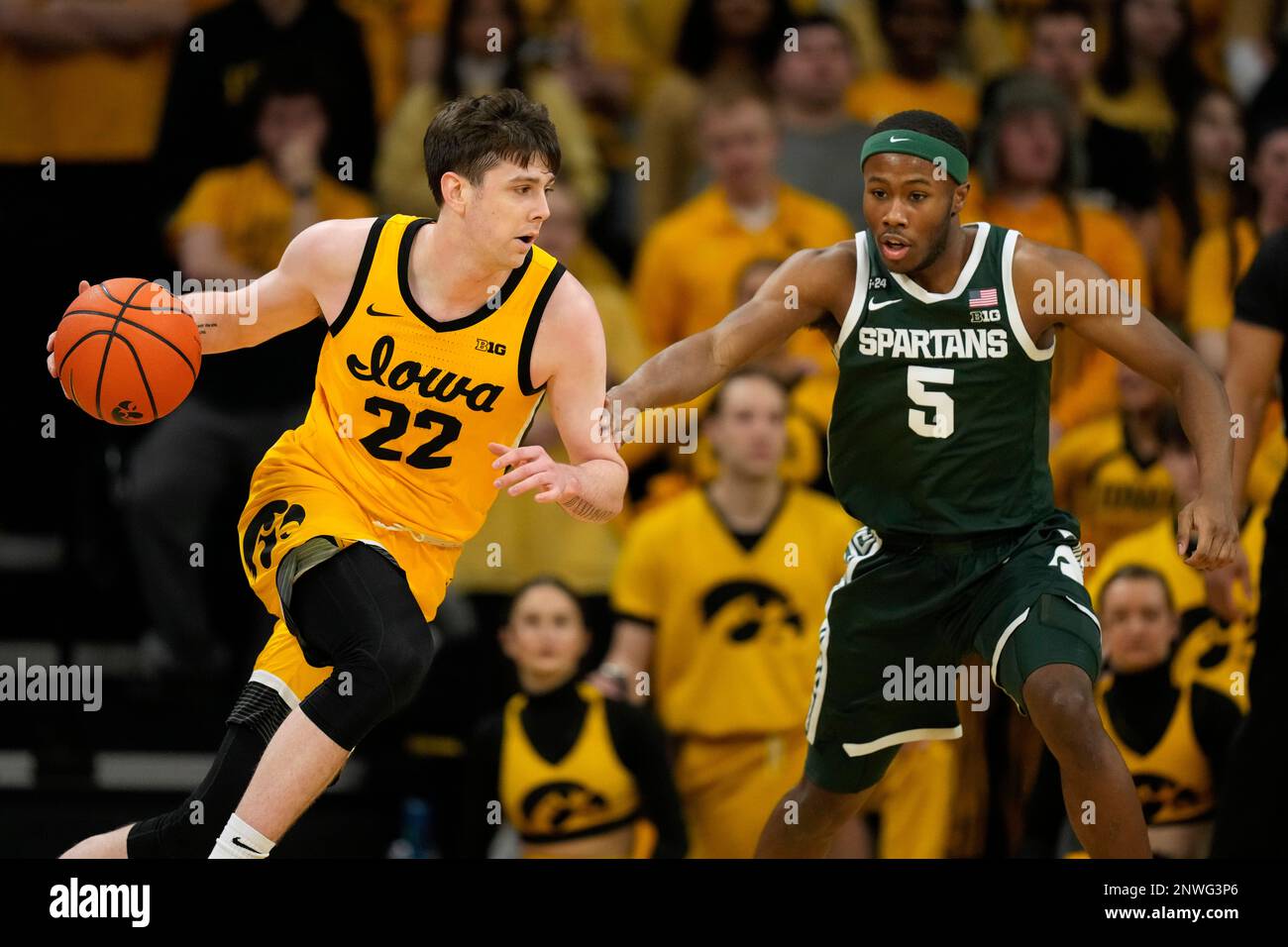 Iowa forward Patrick McCaffery (22) drives past Michigan State guard ...