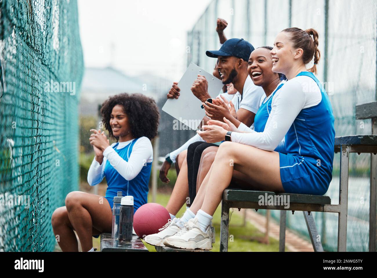 Court, netball and happy coach with women on stand watching game, match ...