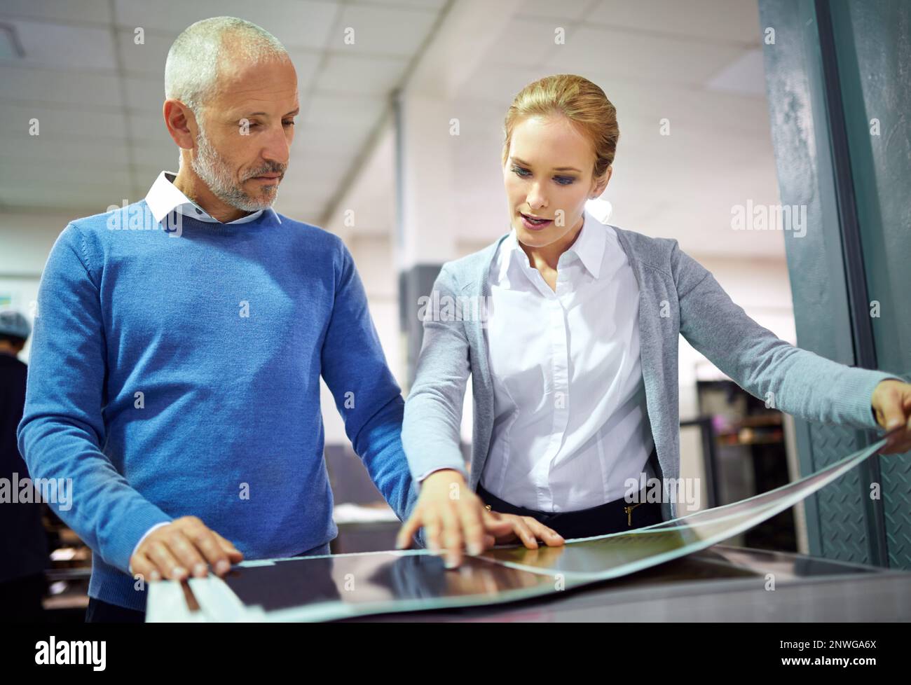 Assuring quality throughout the process. Two publishers assessing the ...