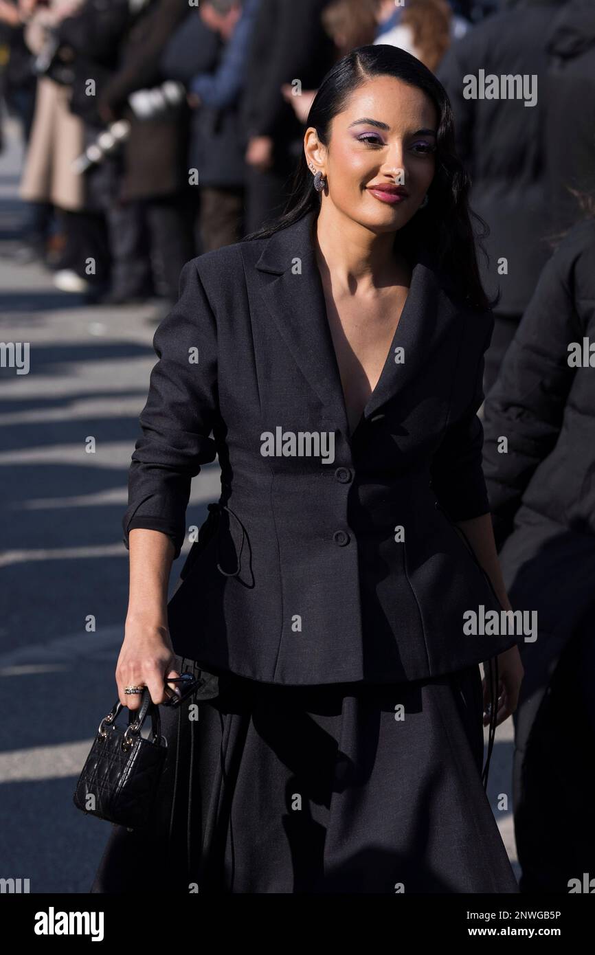 Amina Muaddi poses for photographers upon arrival at the Christian Dior ...