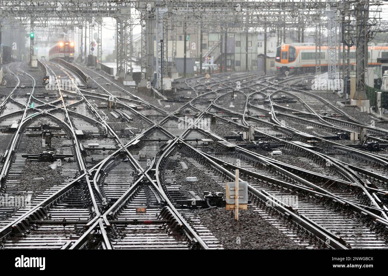 Train passes on railroad making geometric patterns near Yamato Saidaiji ...