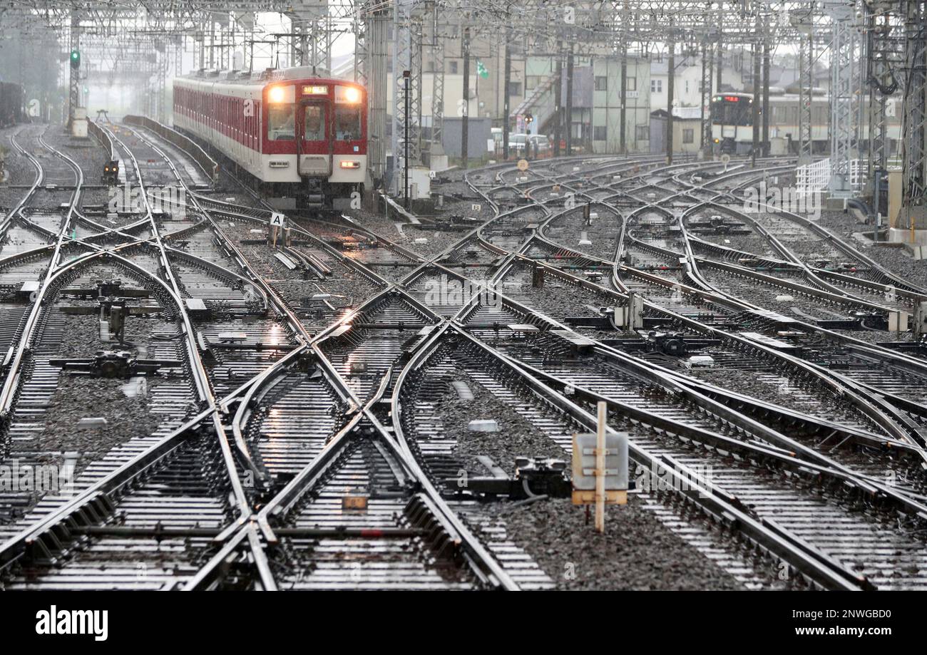Trains pass on railroad making geometric patterns near Yamato Saidaiji ...