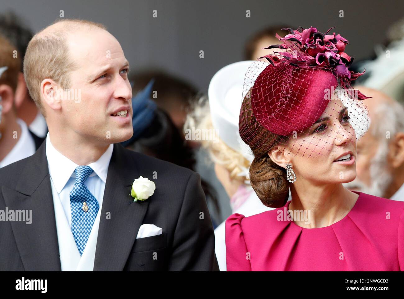 Prince William and Kate, Duchess of Cambridge, look up at the Royal ...