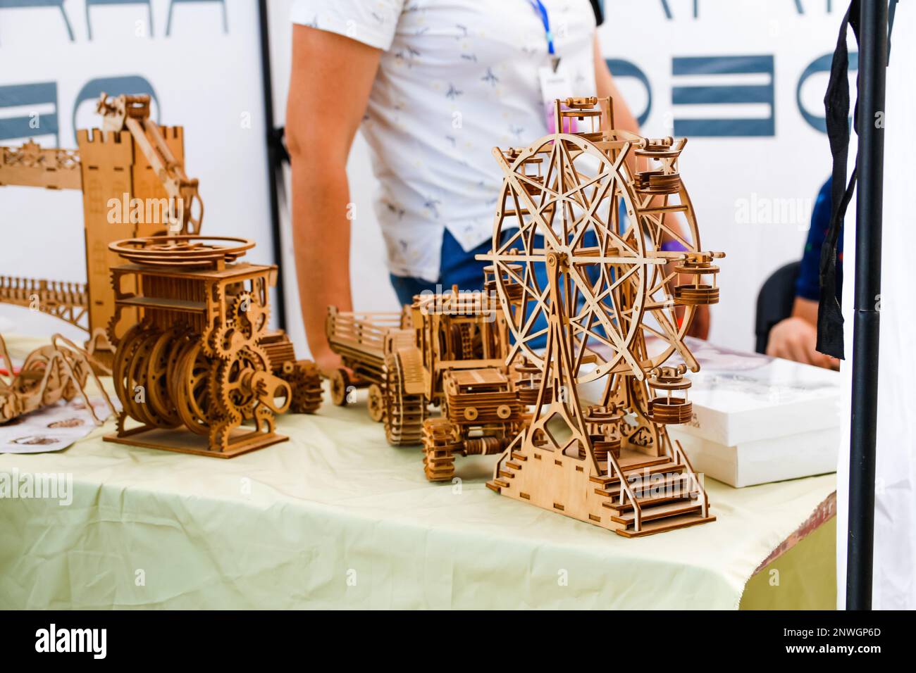 Wooden toys constructor in festival. Creativity craft plywood eco toys ...