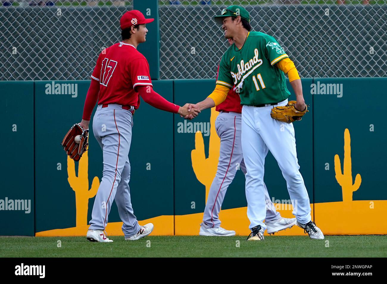 Los Angeles Angels pitcher Shohei Ohtani (17) greets Oakland Athletics pitcher Shintaro Fujinami ...