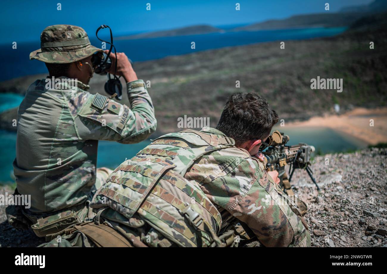 U.S. Army Specialist Adantoni Maduro, squad designated marksman, left ...