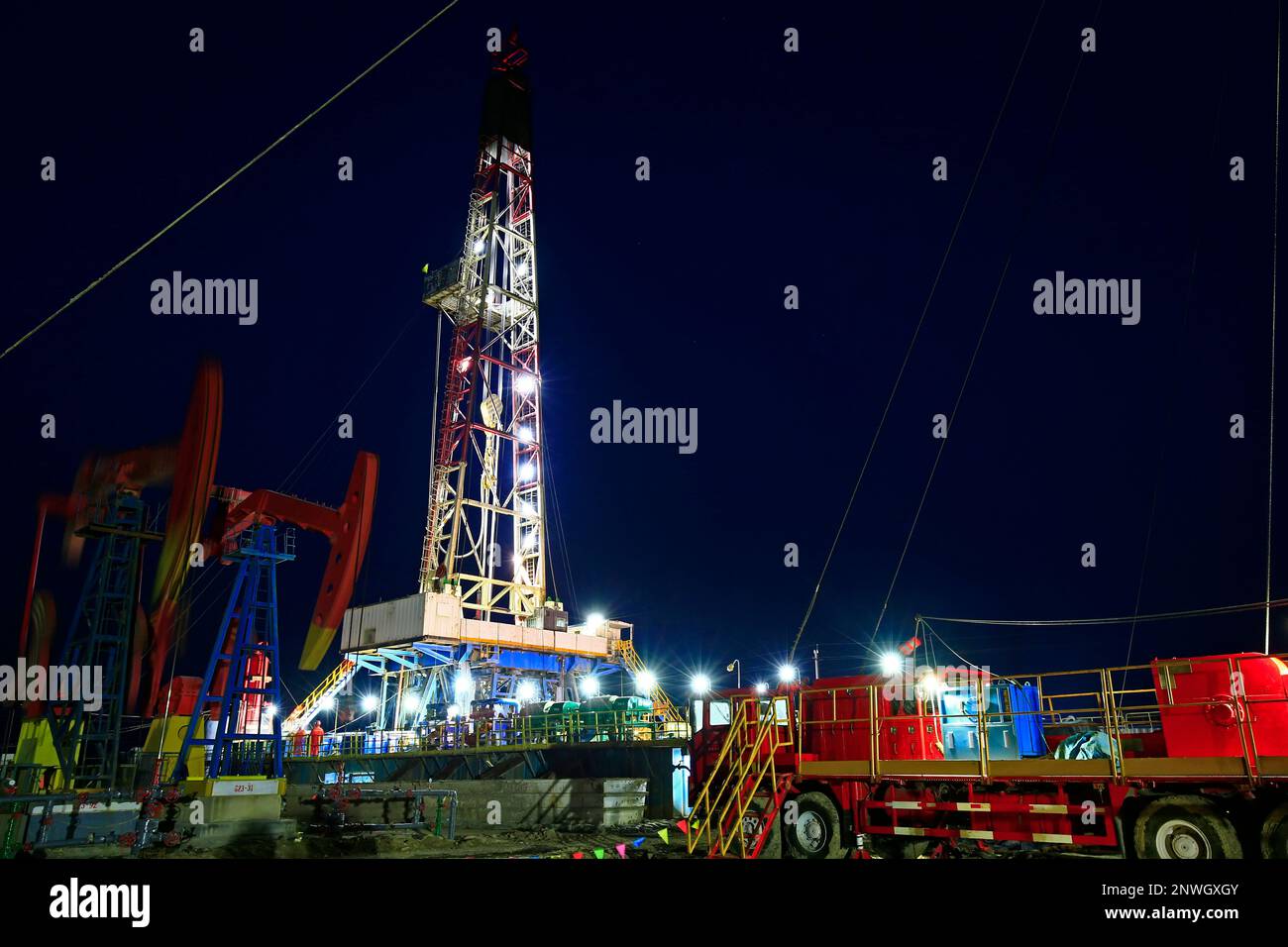 Oil drilling rig in the evening Stock Photo - Alamy