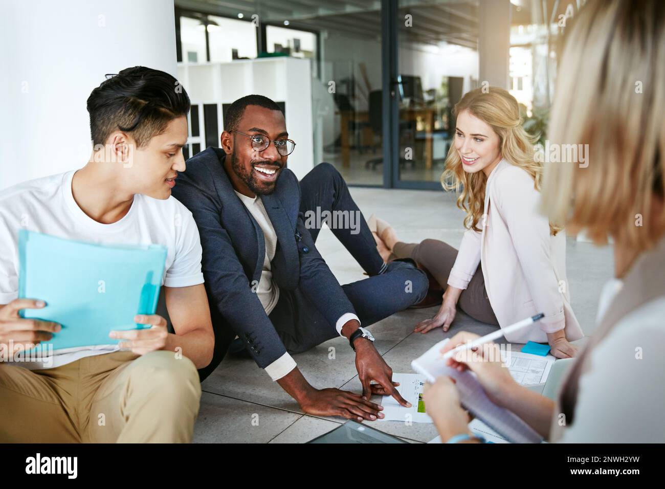 I love that idea. Shot of a group of colleagues having a brainstorming ...
