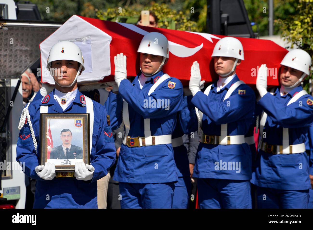 Turkish soldiers carry the national flag-warped coffin of Gendarmerie ...