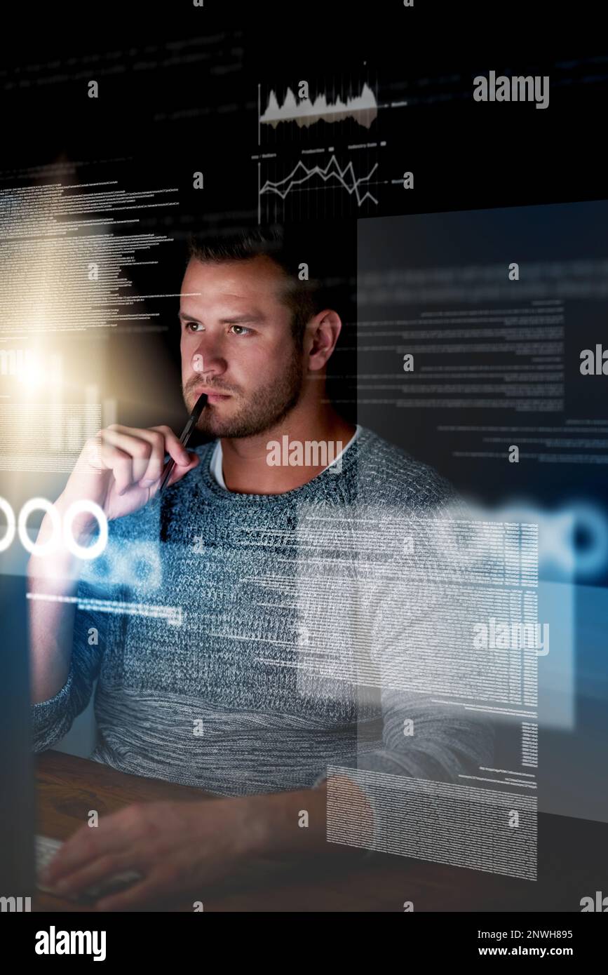 Programming requires razor-sharp focus. Shot of a focussed computer programmer working at his ...