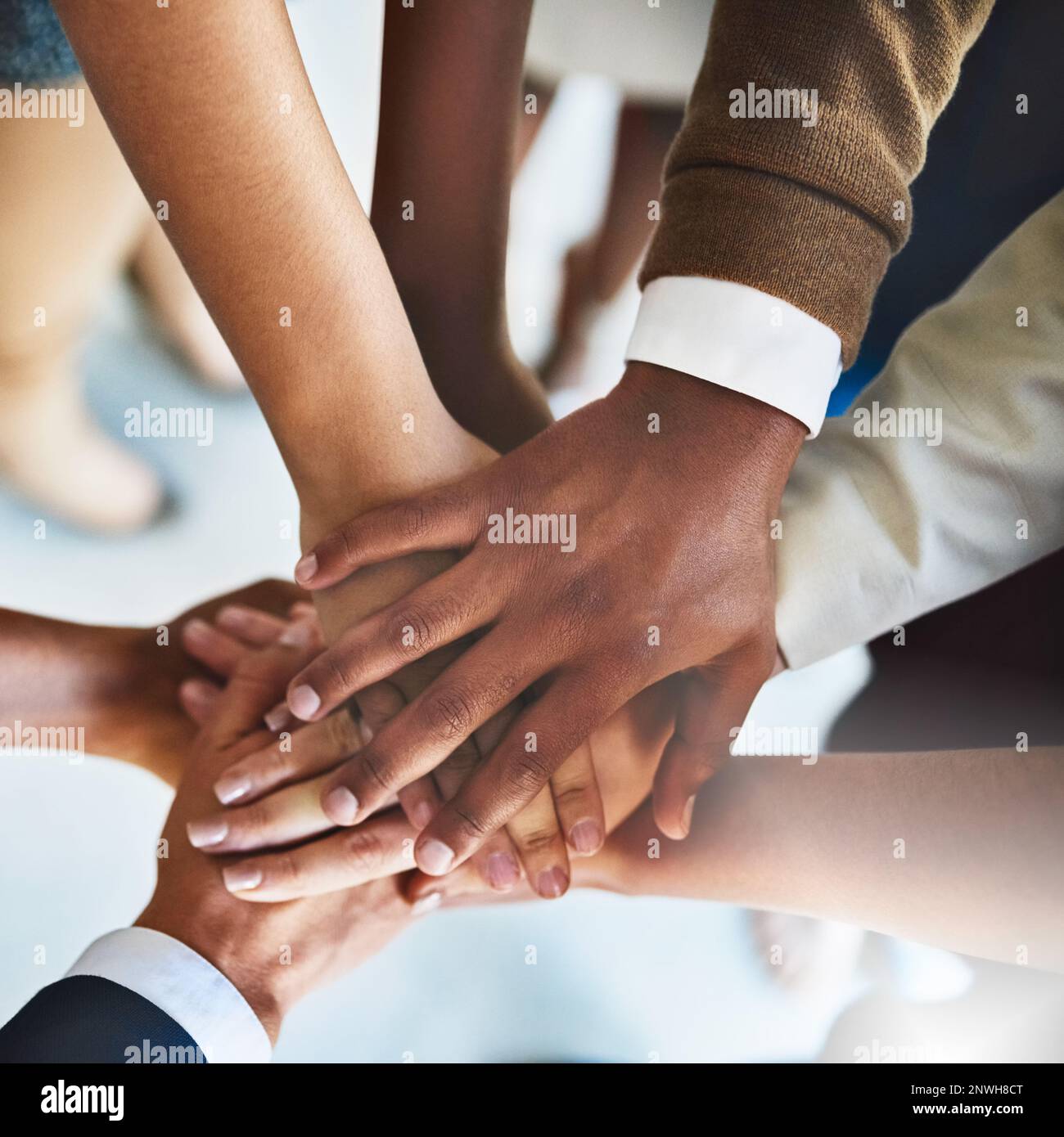 Teams dont work without teamwork. Cropped shot of a group of ...