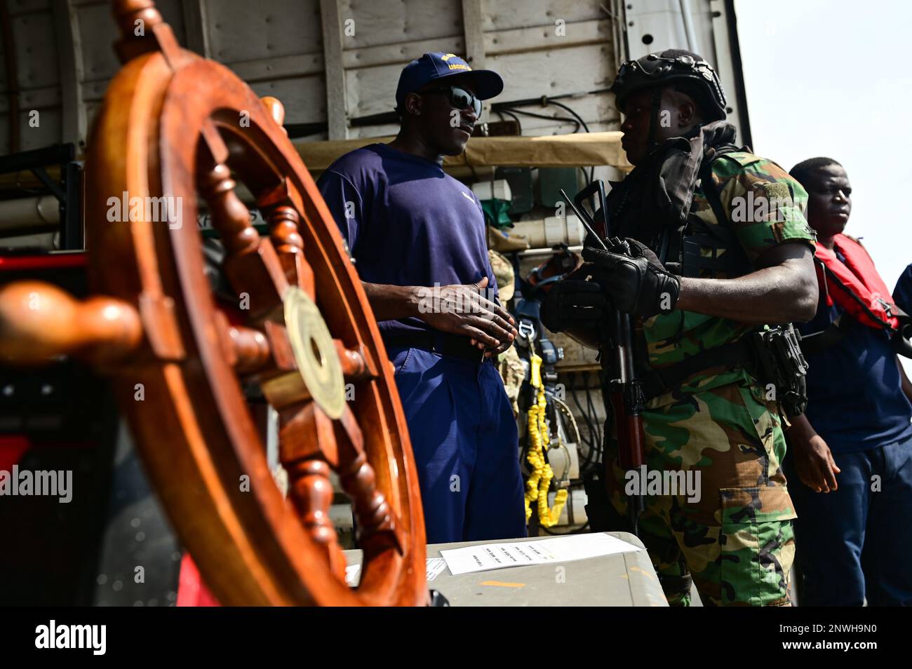 U.S. Coast Guard Ensign Mohammad Diakite speaks with a Togolese Navy ...