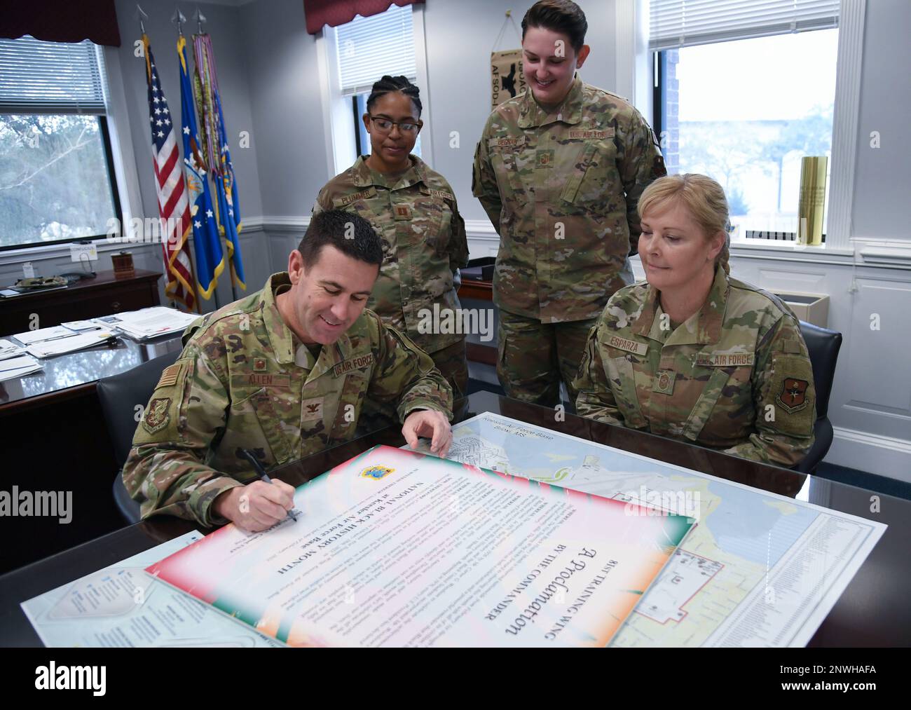 U.S. Air Force Col. Jason Allen, 81st Training Wing commander, signs ...