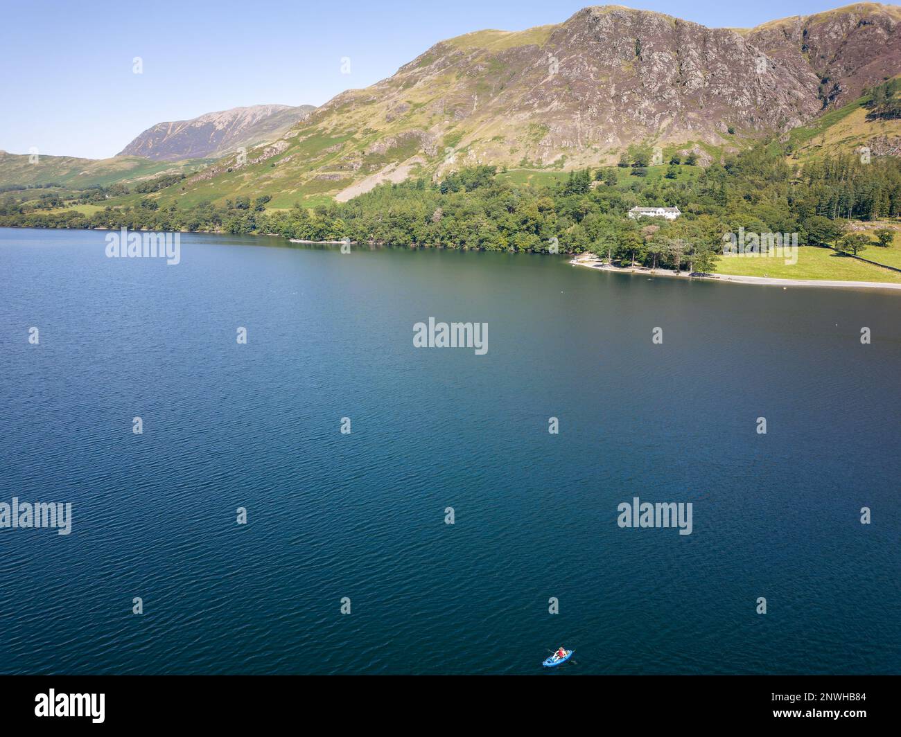 Aerial view of a beautiful lake and small beach in a rural valley ...