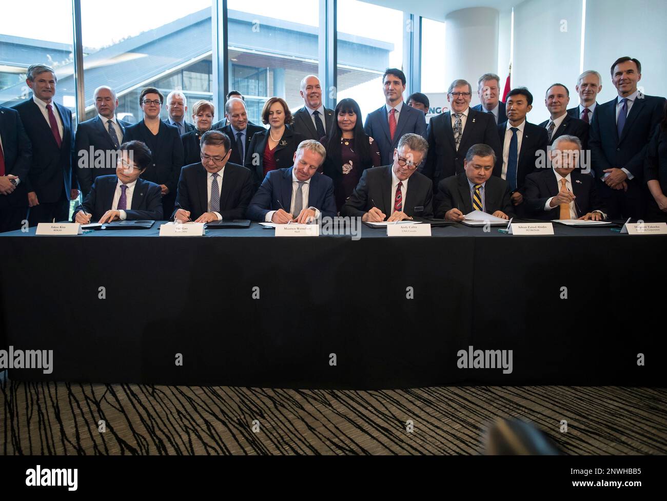 Seated from left to right, Inkee Kim, of KOGAS, Wei Gao, of PetroChina ...