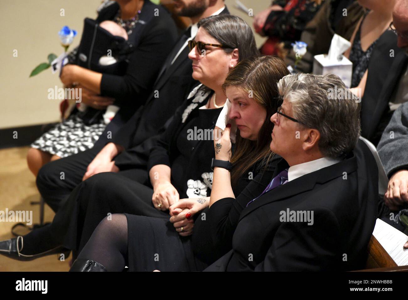 Andrea Parise, wife of Joseph Parise, sits between her parents, Mike ...