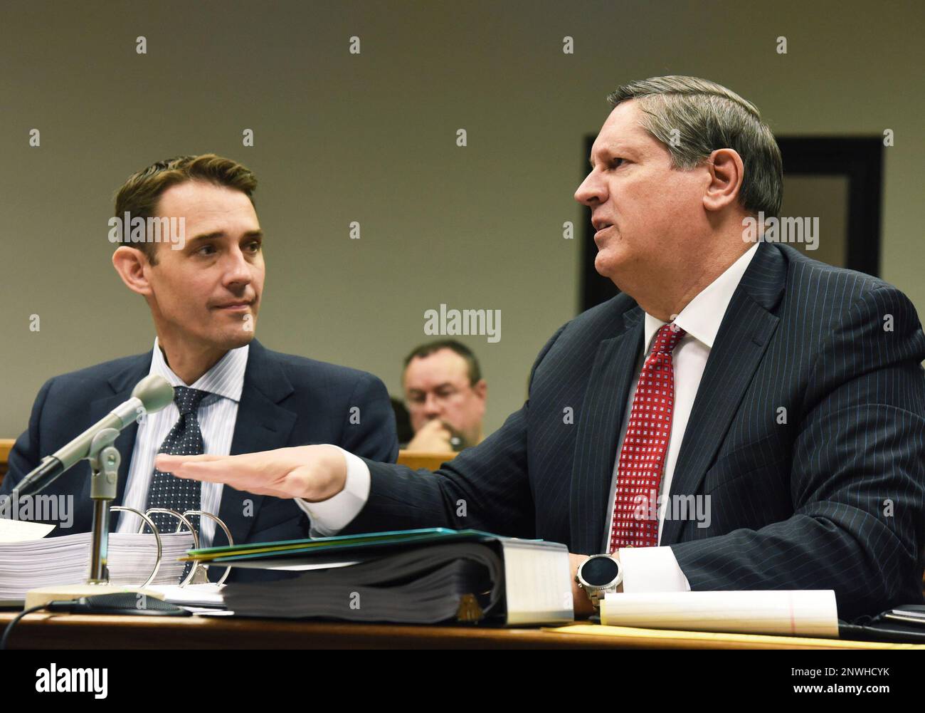 Ryan Bangert, assistant attorney general, left, listens as attorney ...