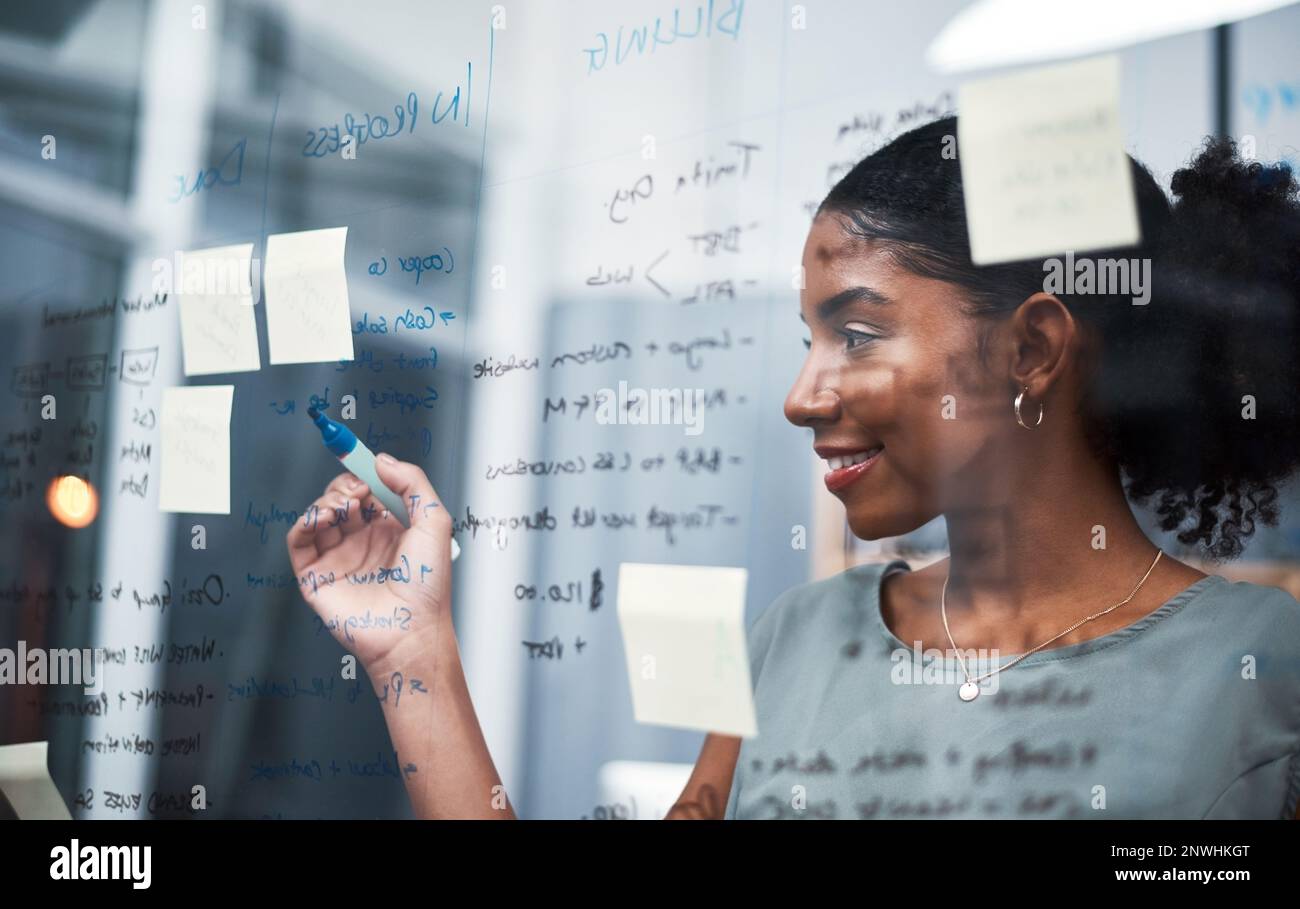The expert mind behind an expert plan. Shot of a young businesswoman ...