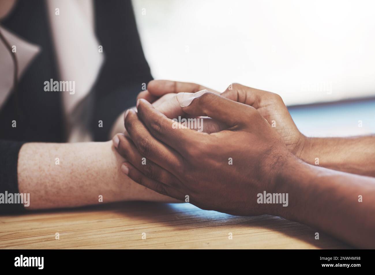 Kindess is a verb. Cropped shot of two people holding hands in comfort ...
