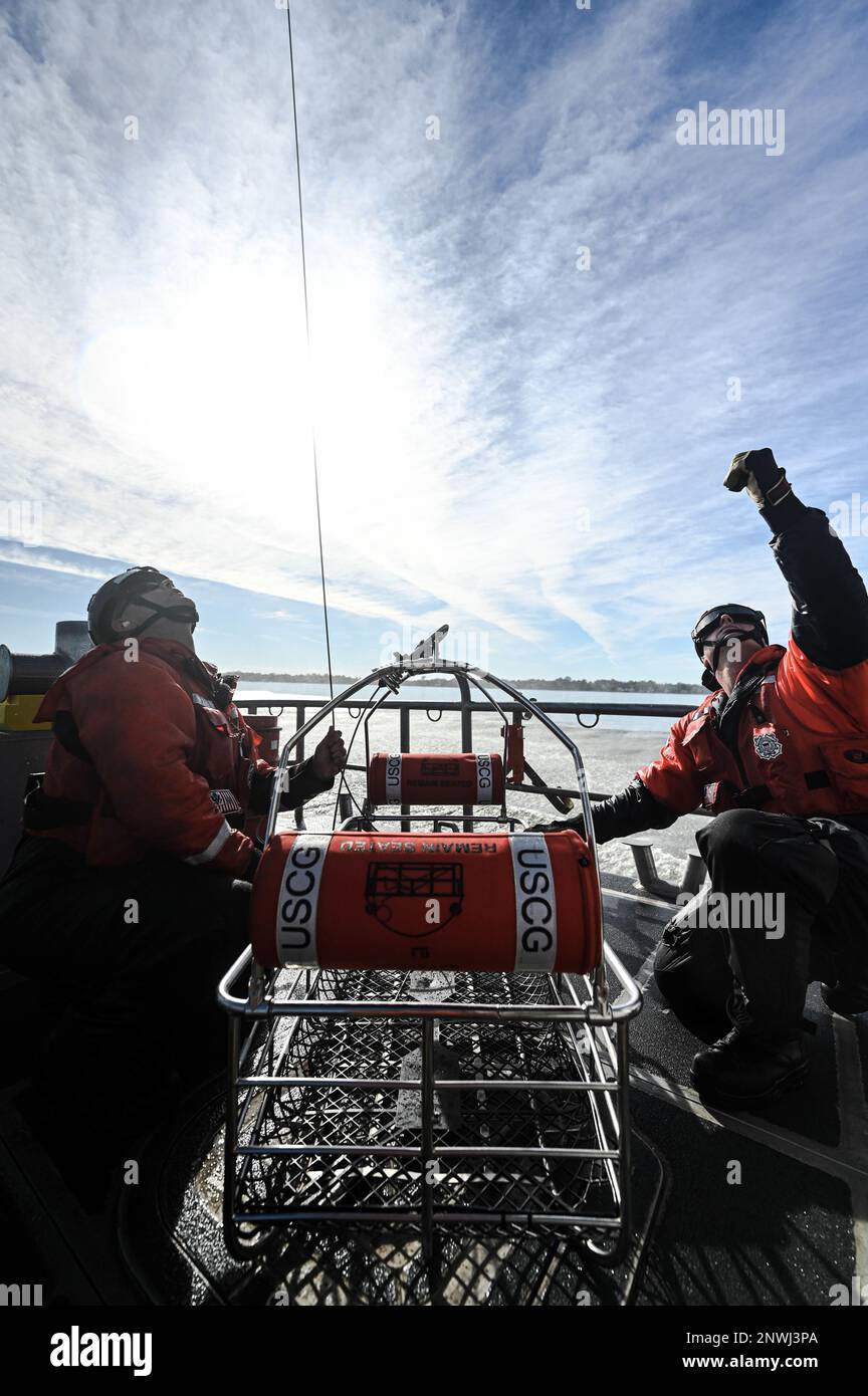 U.S. Coast Guard Seaman Eric Buckle, left, and Boatswains Mate 3rd ...