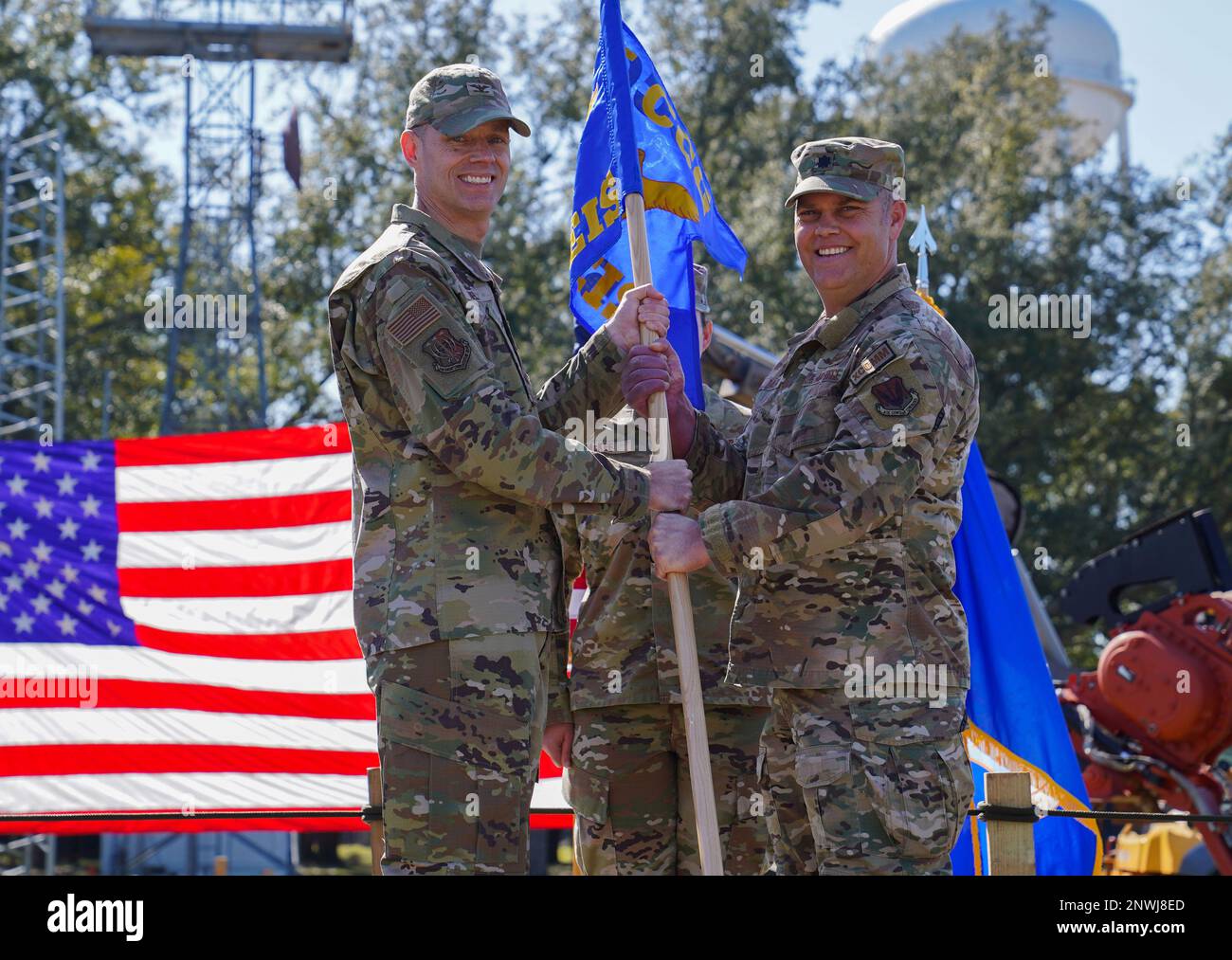U.S. Air Force Col. Dave Abel, 5th Combat Communications Squadron commander, passes the guidon ...