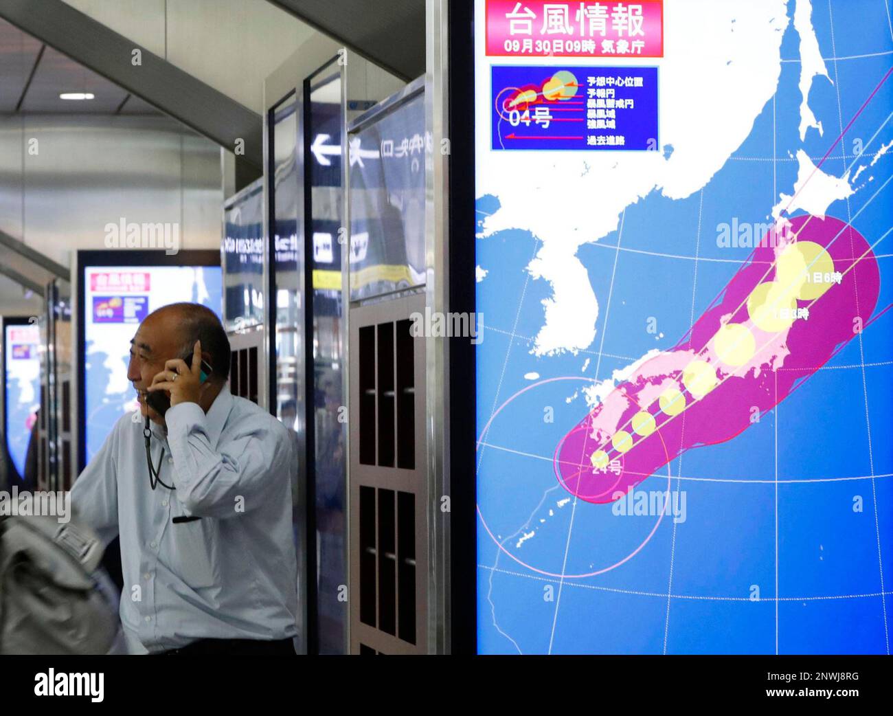 The path of Typhoon Trami is seen on a monitor at Osaka station, in ...