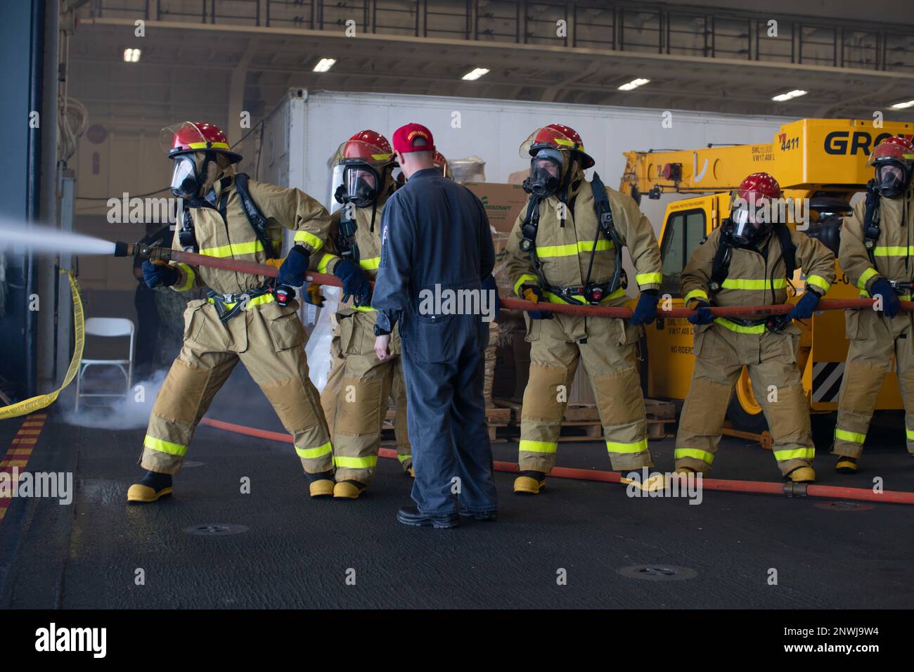 230203-N-TT639-1410 PACIFIC OCEAN (Feb. 3, 2023) – Sailors use a fire ...