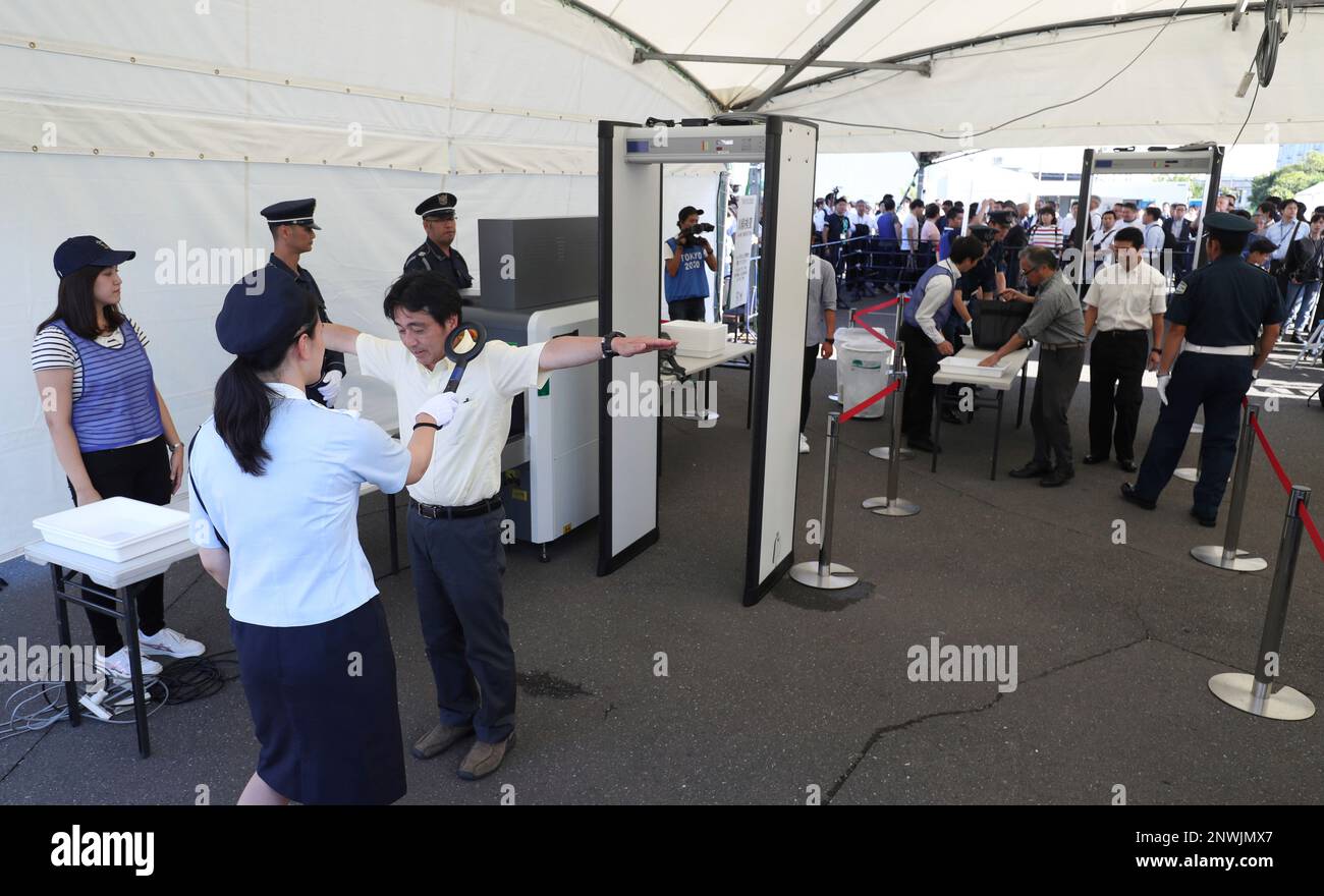 People participate a security test for spectators at PSA, screening area for passengers, during ...
