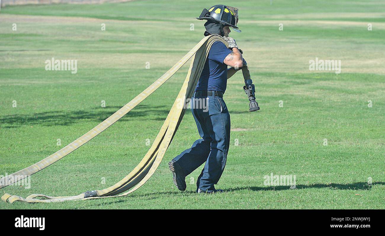 Yuma Fire Department rookie firefighter Jonathan Endres drags fire hose ...