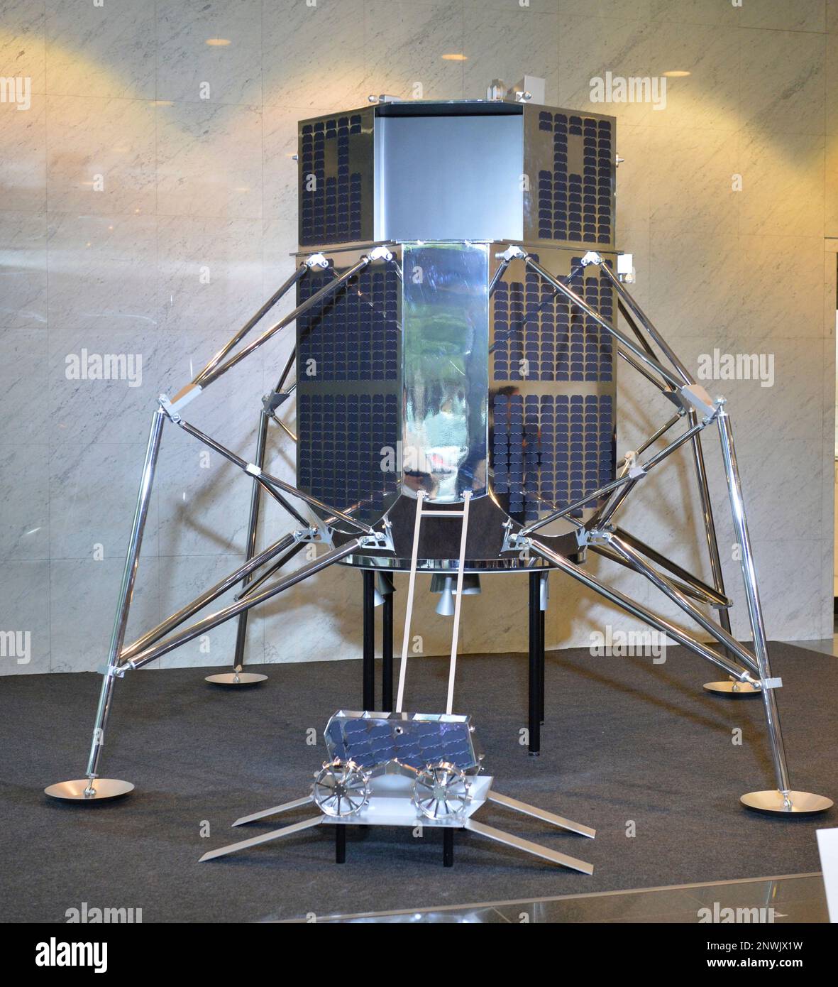A picture shows full‐scale mock-ups of HAKUTO-R Lander and Rover in ...