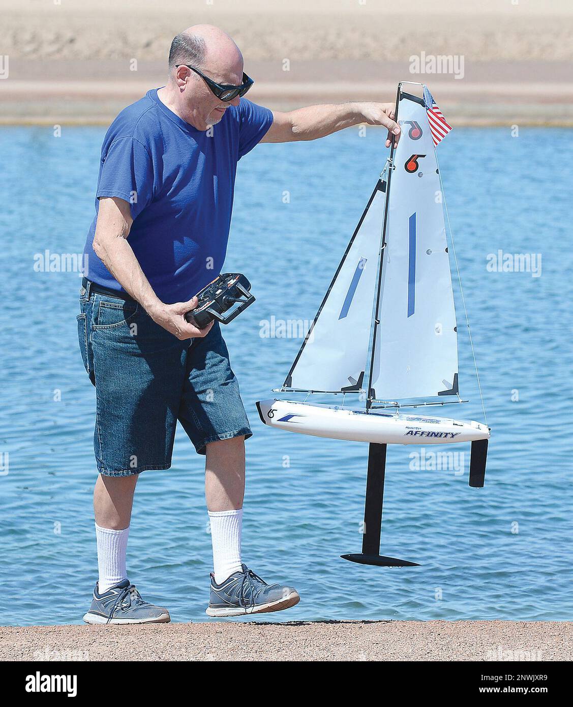 Done for the day, Lee Hayes removes his radio controlled sailboat the ...