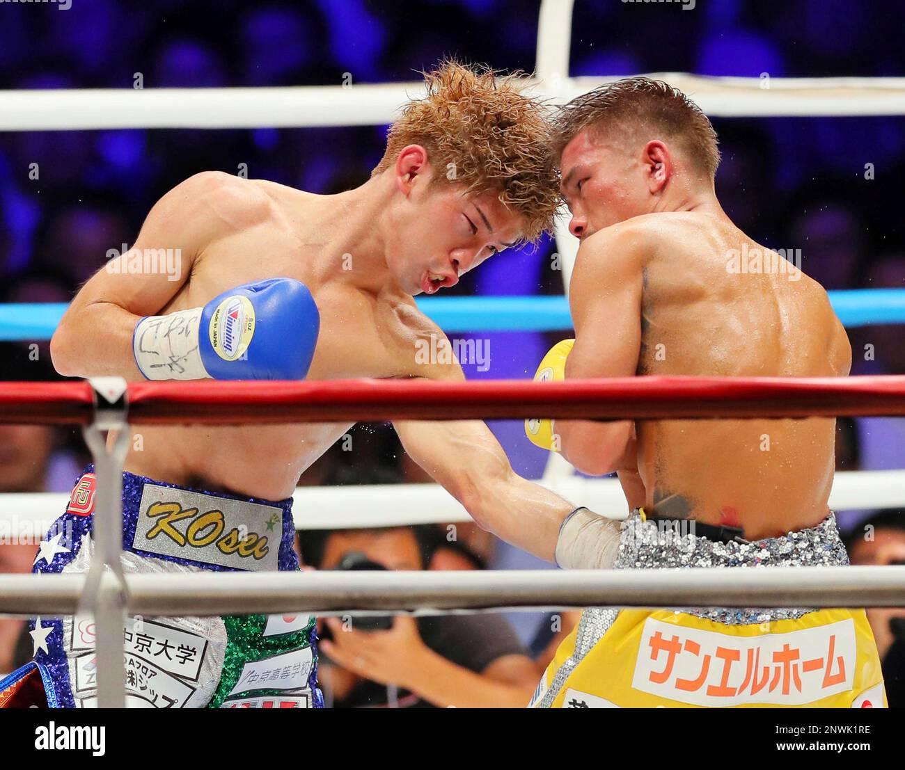 Japan's challenger Kosei Tanaka throws a punch against flyweight Champion Sho Kimura during the ...