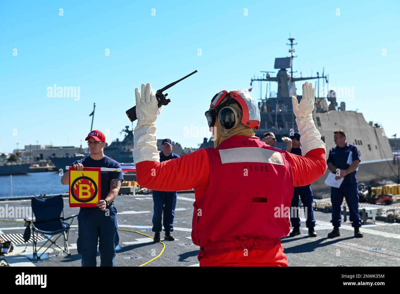 USCGC Stone's (WMSL 758) crew runs a helicopter crash response training ...