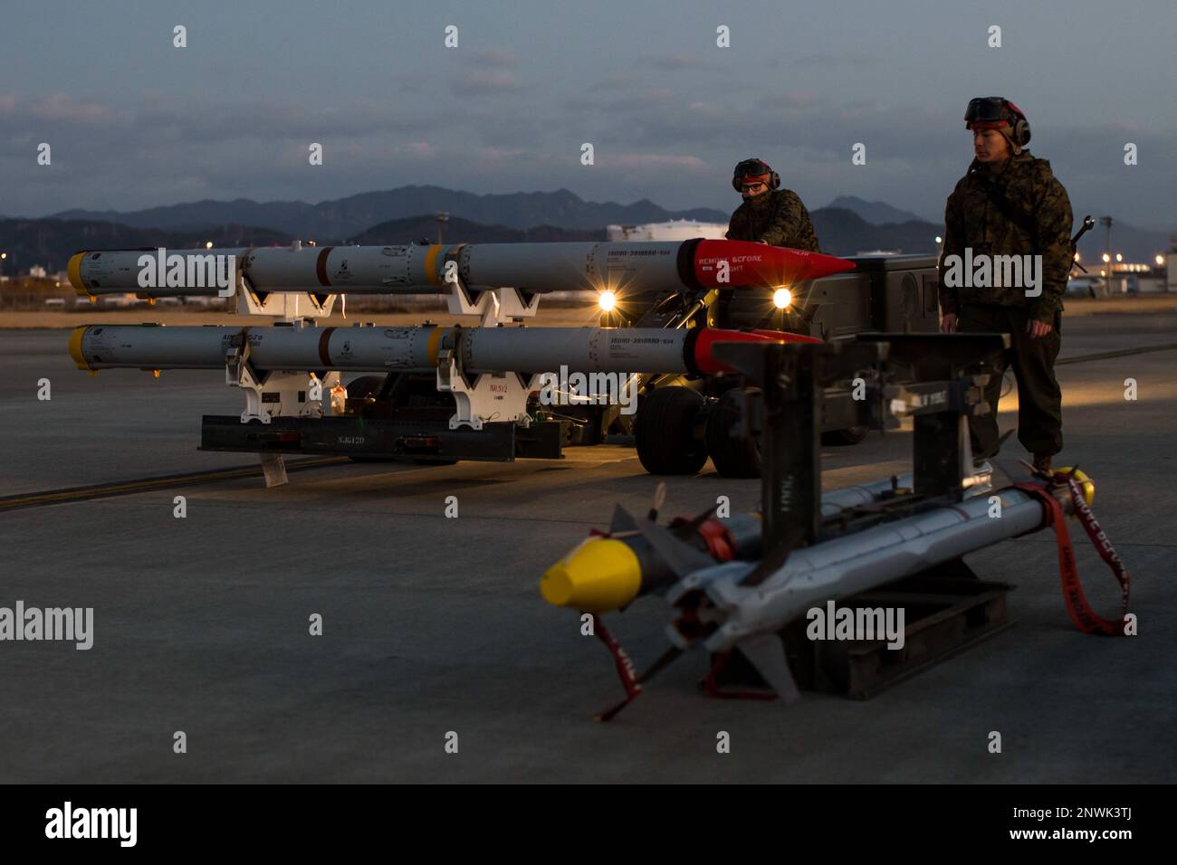 U.S. Marines with Marine Fighter Attack Squadron 242 safely transport AIM-120 Advanced Medium ...