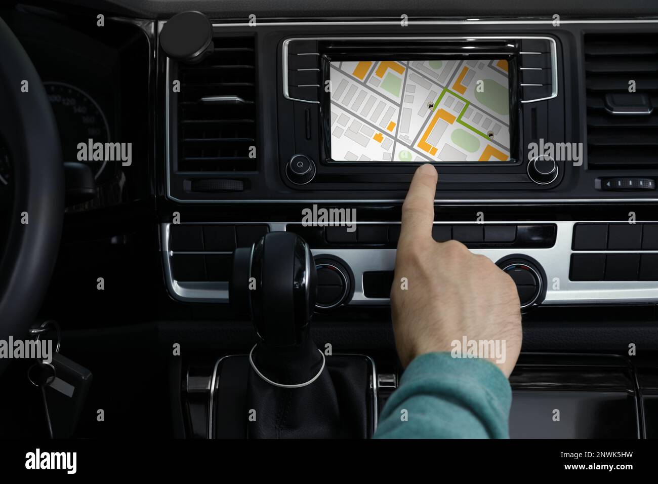 Man using navigation system while driving car, closeup Stock Photo - Alamy