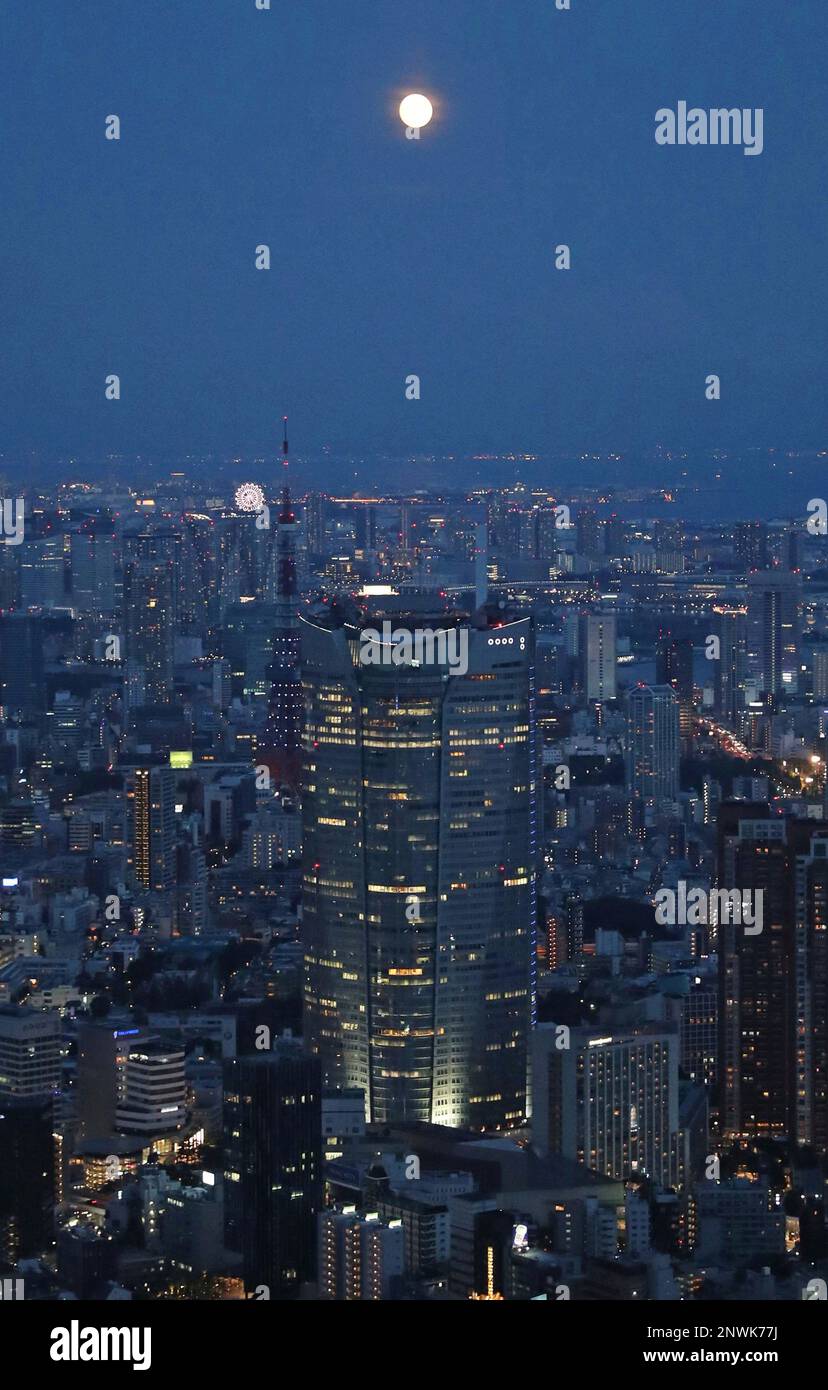 An aerial photo shows the harvest moon in Tokyo on September 24, 2018 ...