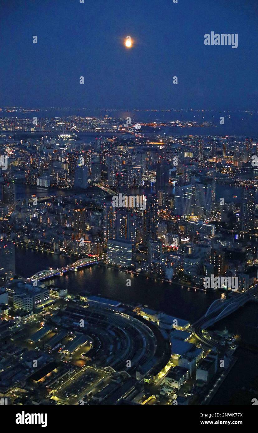 An aerial photo shows the harvest moon in Tokyo on September 24, 2018 ...