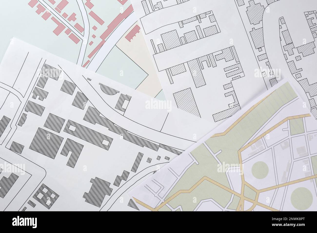 Many different cadastral maps of territory with buildings as background ...