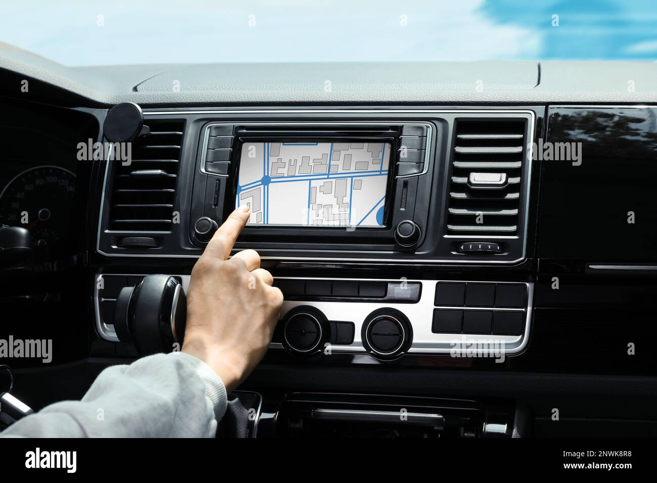 Man using navigation system while driving car, closeup Stock Photo - Alamy
