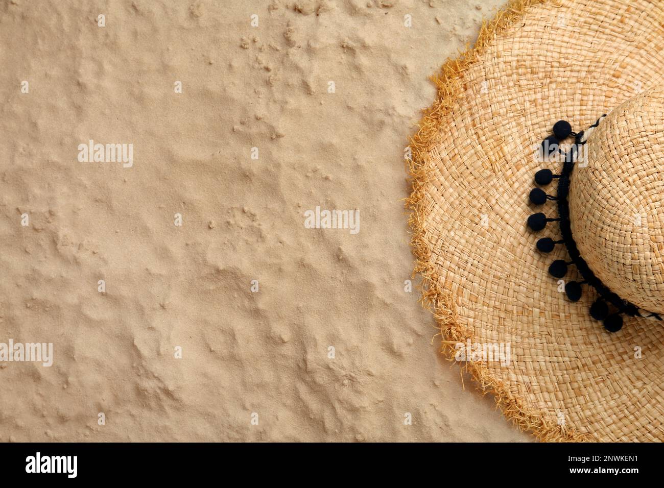 Stylish straw hat on sand, top view. Space for text Stock Photo - Alamy