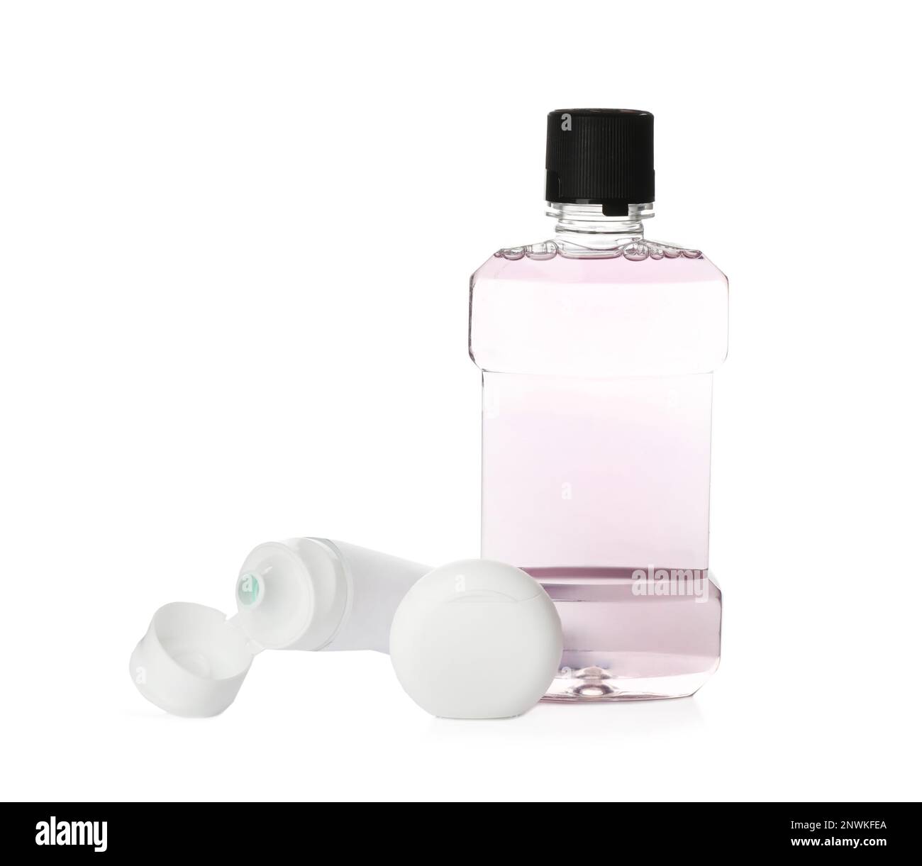 Mouthwash, dental floss and toothpaste on white background Stock Photo ...
