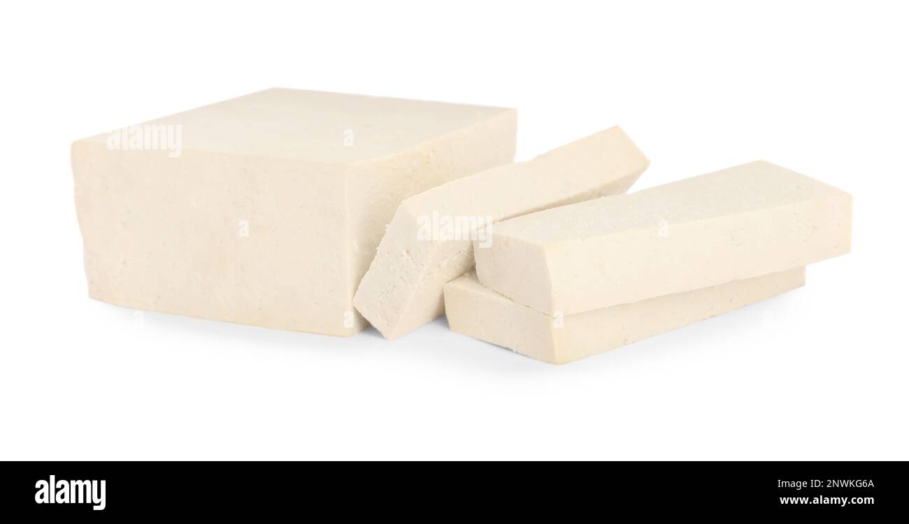 Cut raw tofu block on white background Stock Photo - Alamy