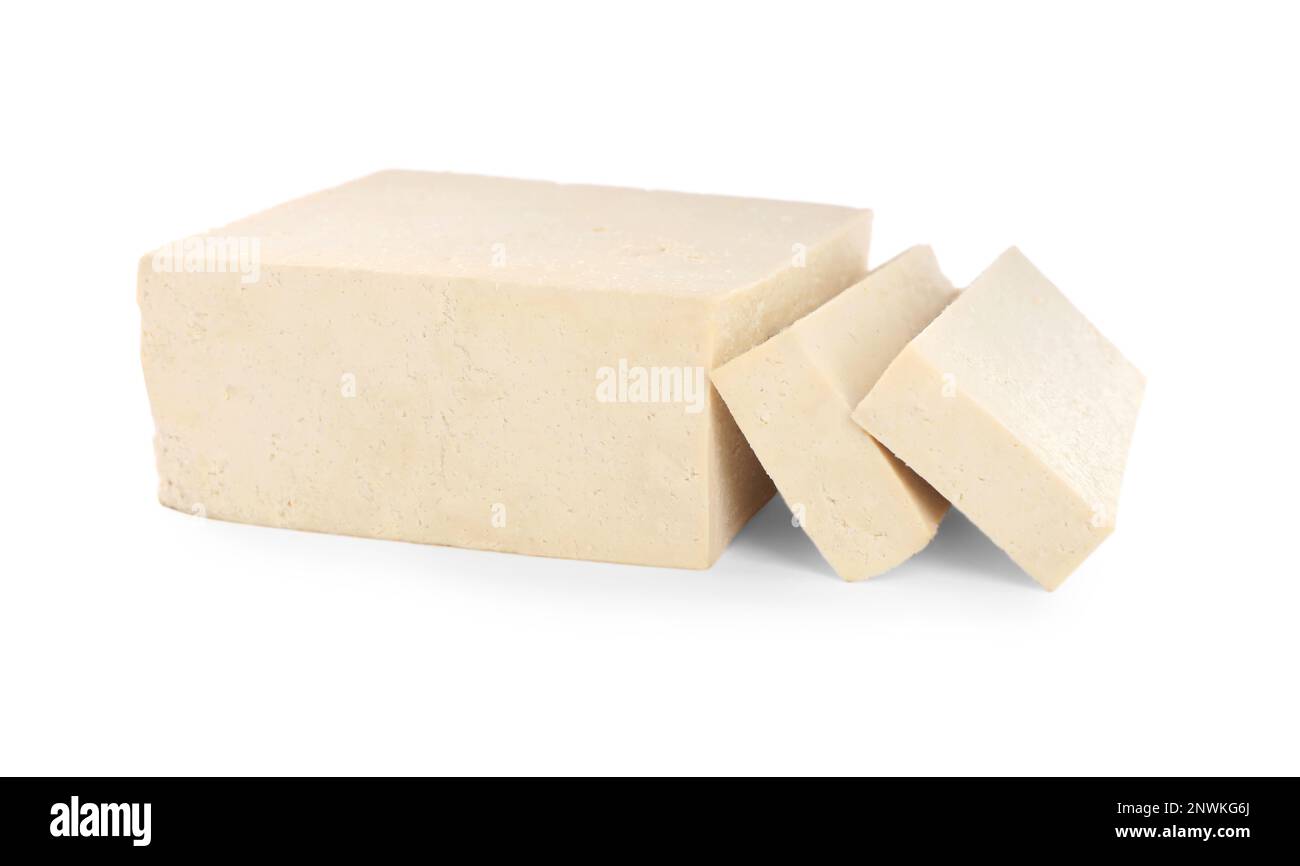 Cut raw tofu block on white background Stock Photo - Alamy